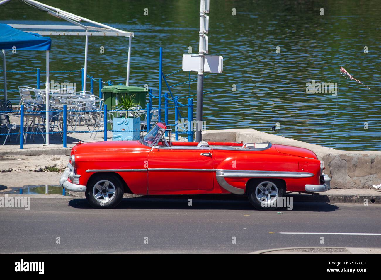 A Red vintage convertible parked at canal de entrada, Habana Vieja ...