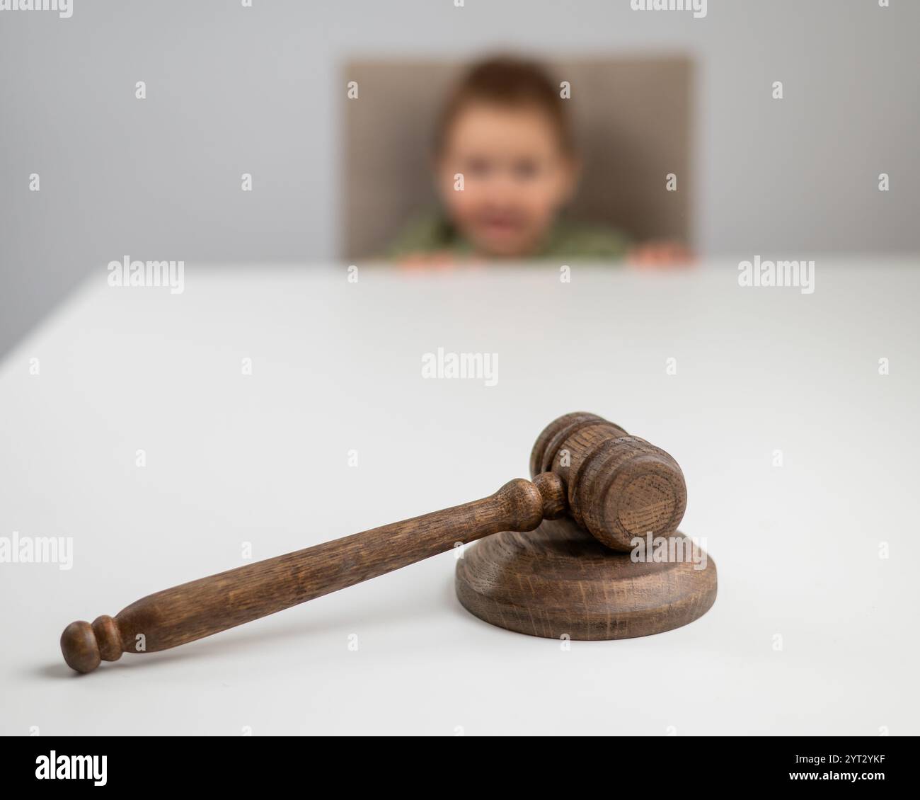 Little boy behind judge's gavel Stock Photo - Alamy