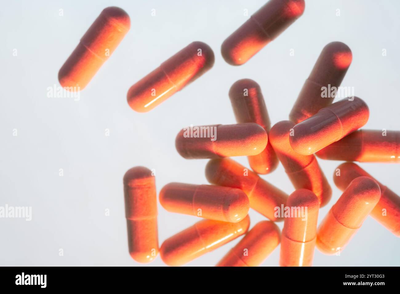 Bright orange supplement or medication capsules Stock Photo - Alamy