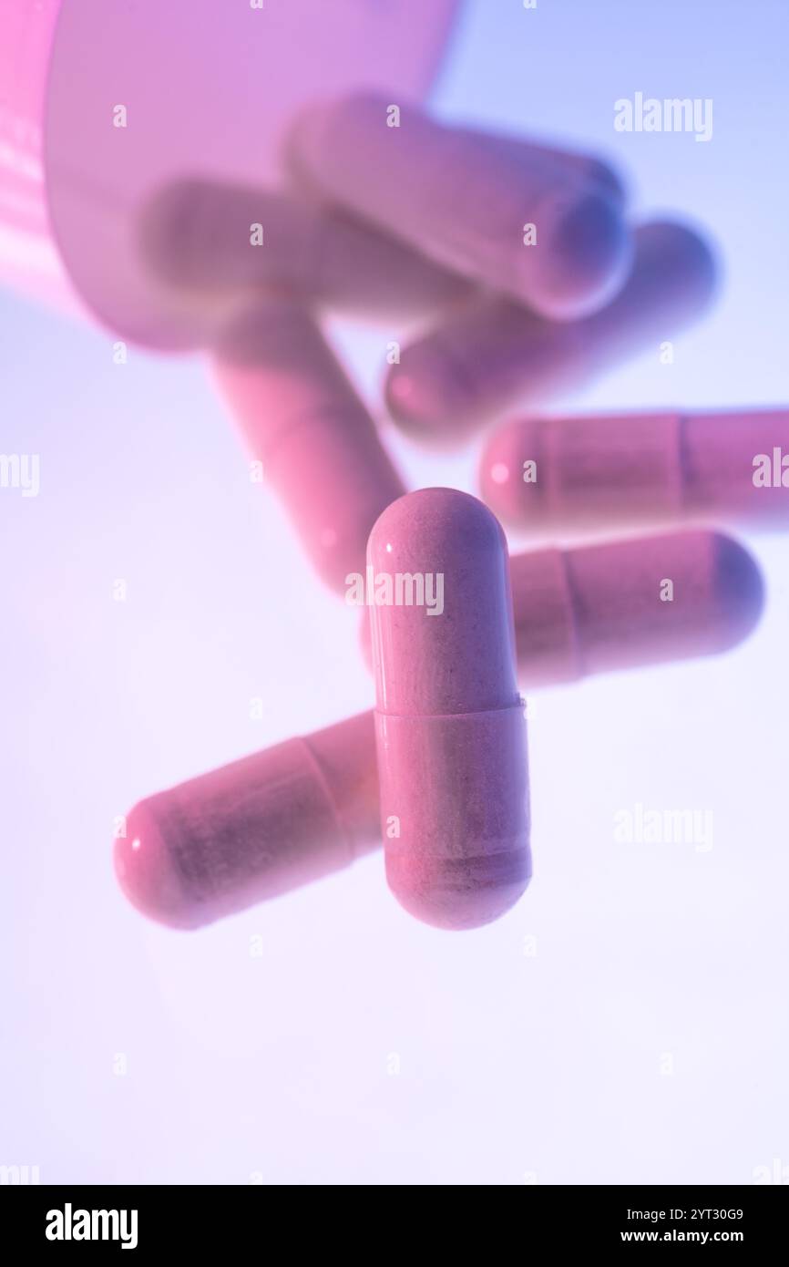 Pink Medication Capsules on white Background Stock Photo - Alamy
