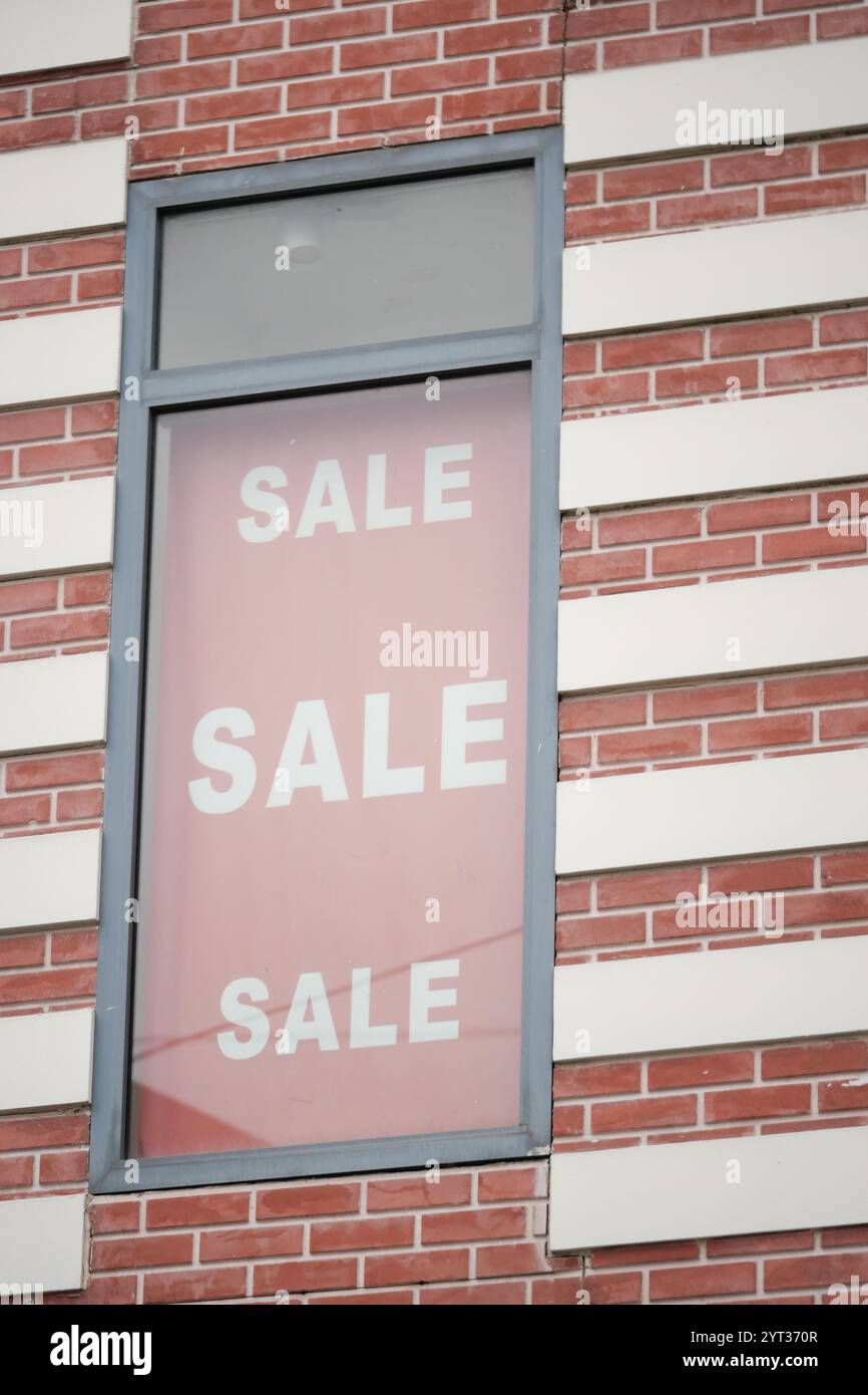 A Bright and EyeCatching Sale Sign Positioned in the Retail Window ...