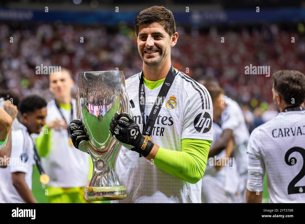 Thibaut Courtois of Real Madrid poses for a photo with trophy during ...