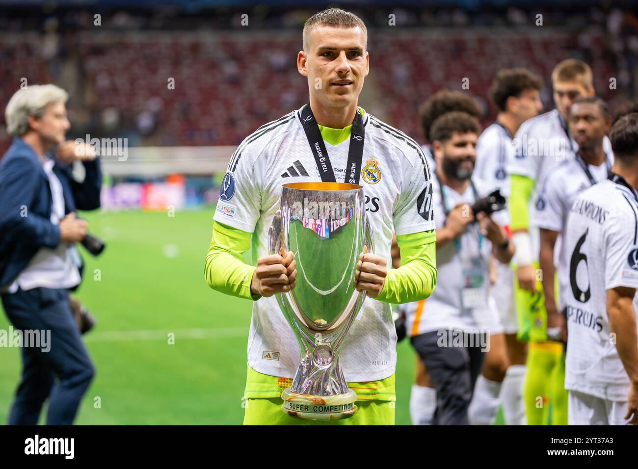 Andriy Lunin of Real Madrid poses for a photo with trophy during the ...