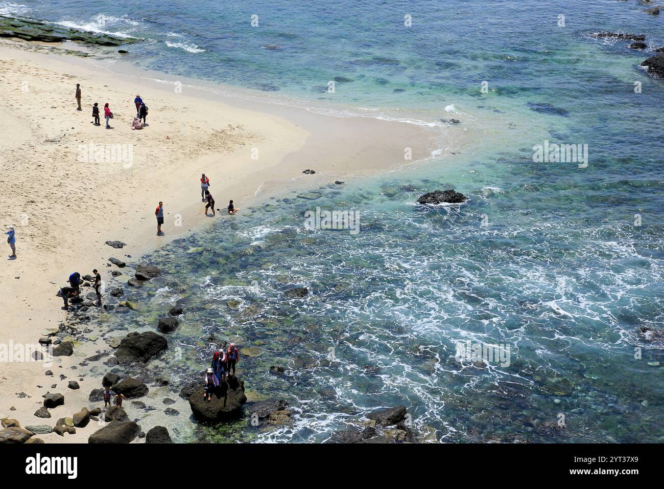 Aerial view, local tourists visit Papuma Beach Stock Photo - Alamy