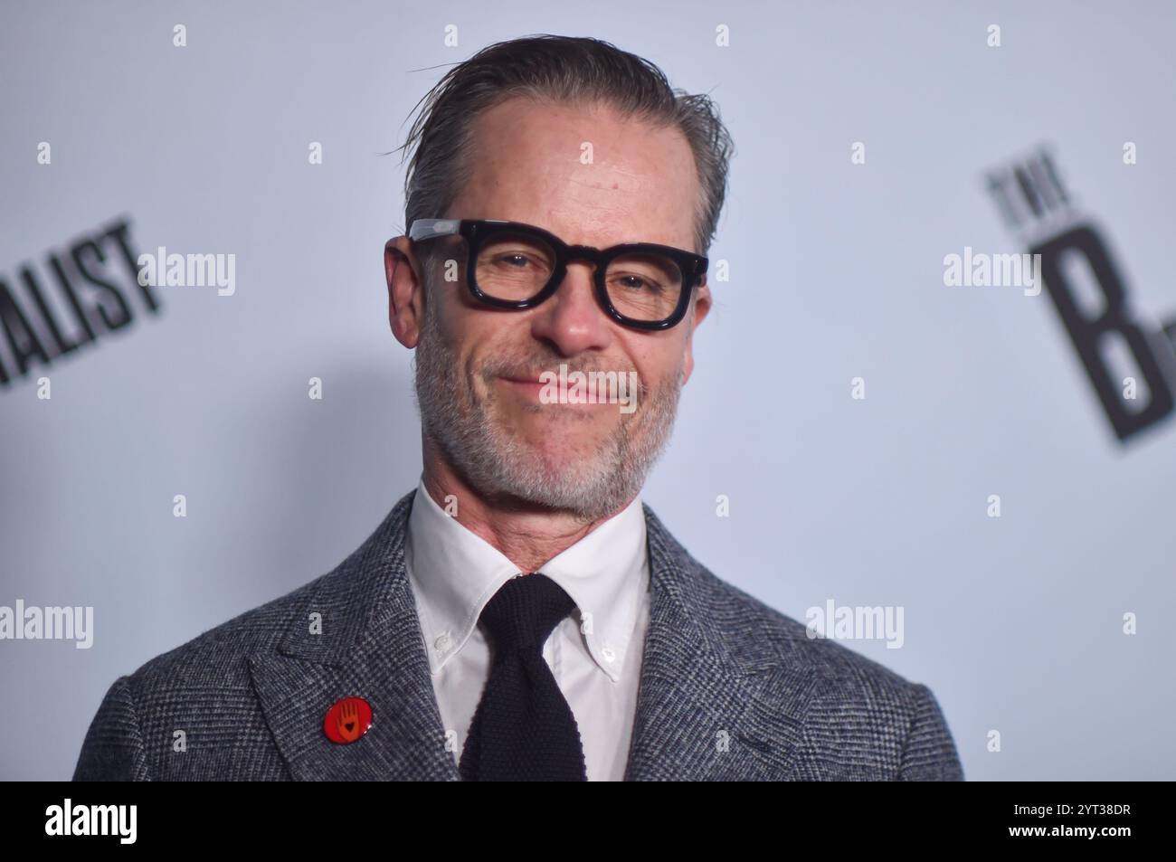 Guy Pearce arrives at the premiere of "The Brutalist" on Thursday, Dec ...