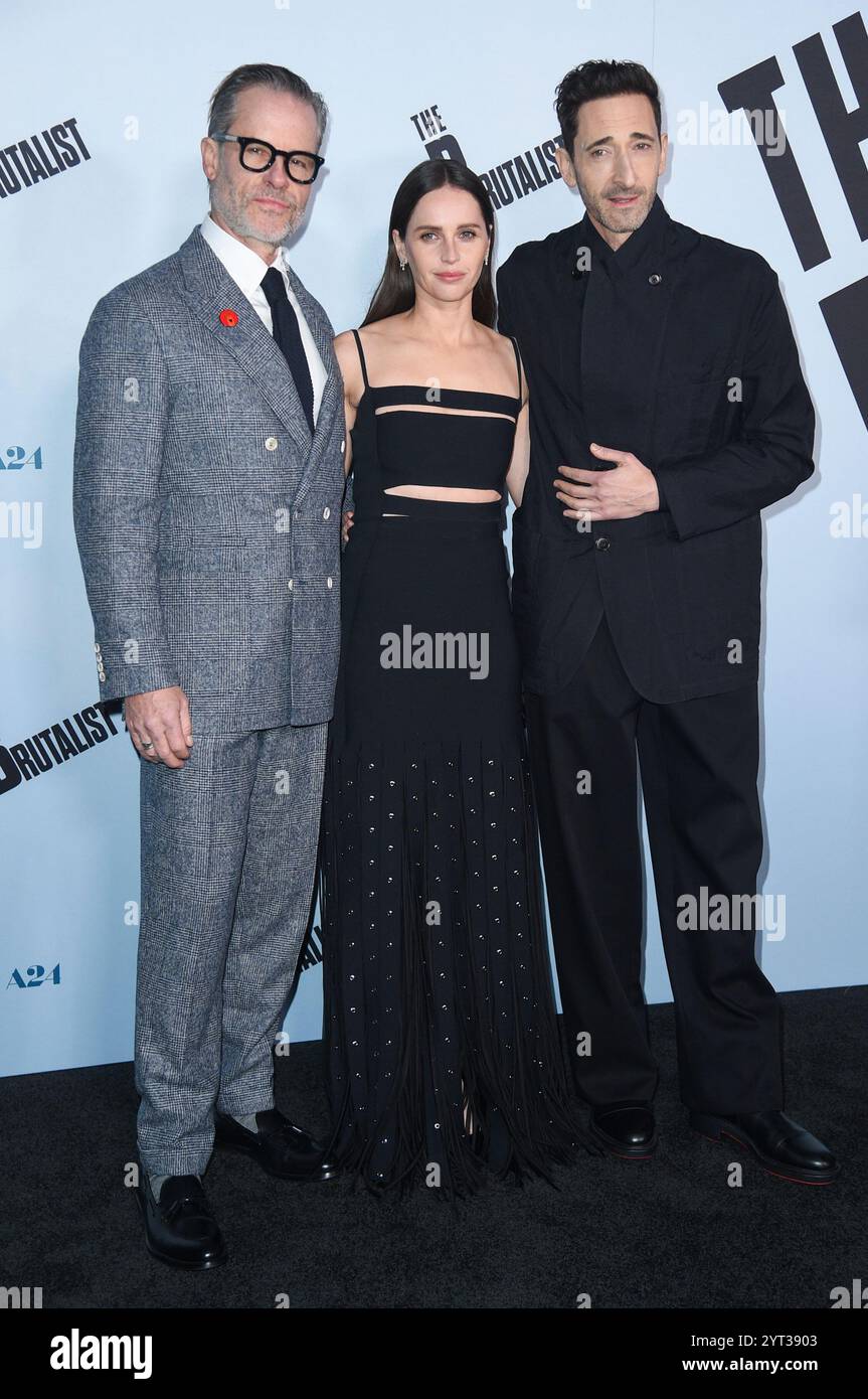 Guy Pearce, from left, Felicity Jones, and Adrien Brody arrive at the premiere of "The Brutalist ...