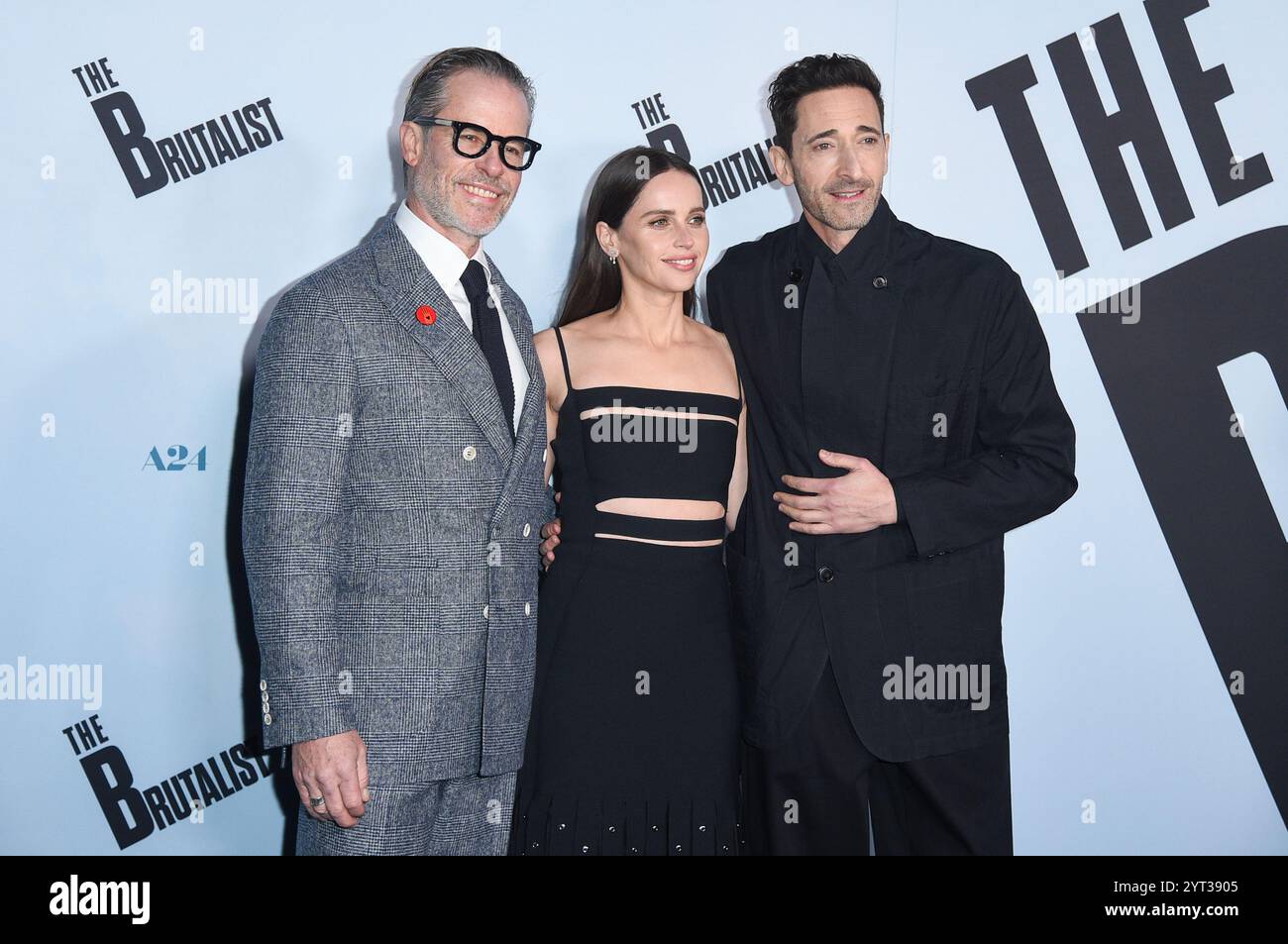 Guy Pearce, from left, Felicity Jones, and Adrien Brody arrive at the premiere of "The Brutalist ...