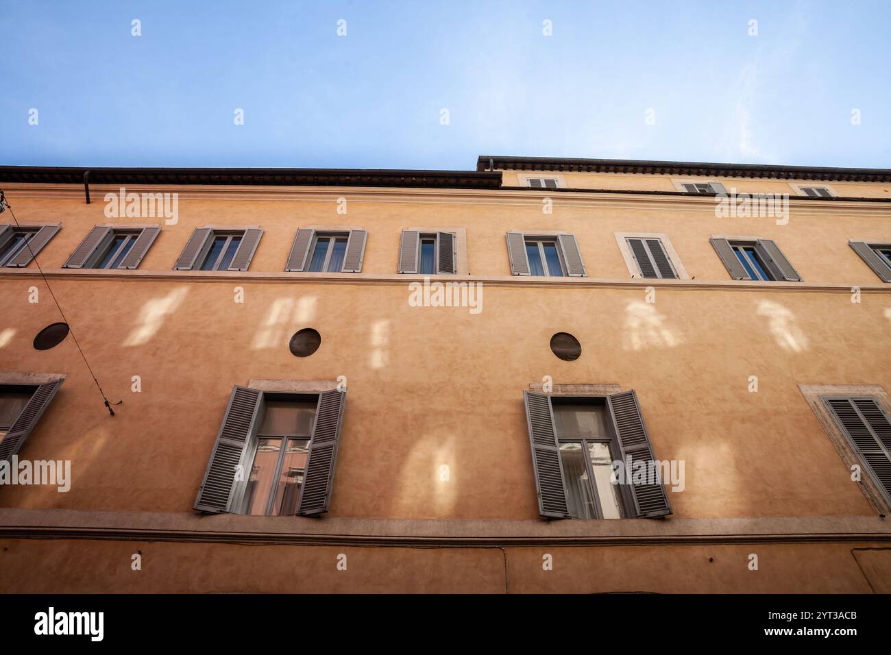 Facade of old residential building in the historic part of Rome, Italy ...