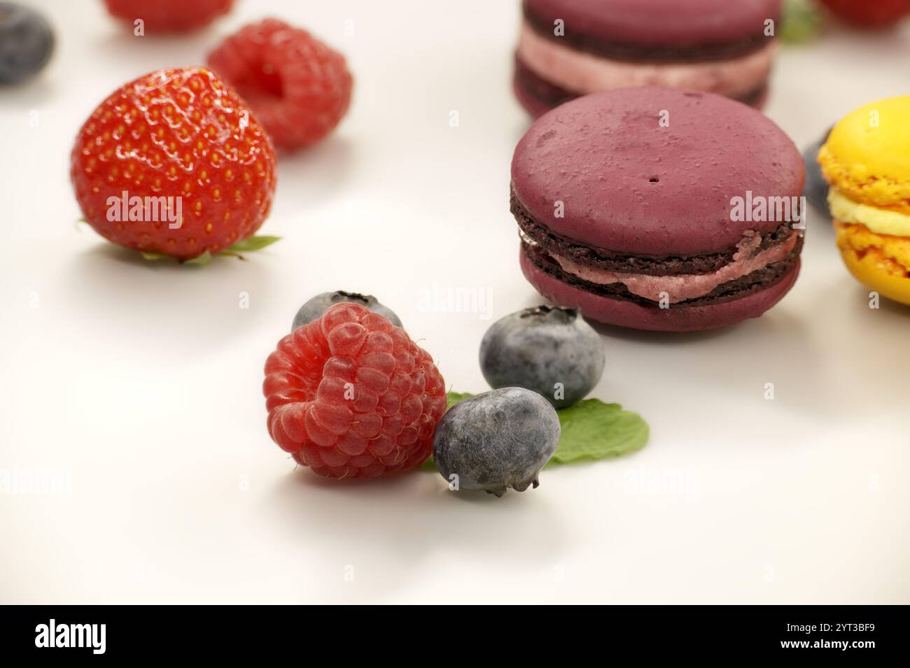 Table filled with array of macaroons and fruits visual appeal of the ...