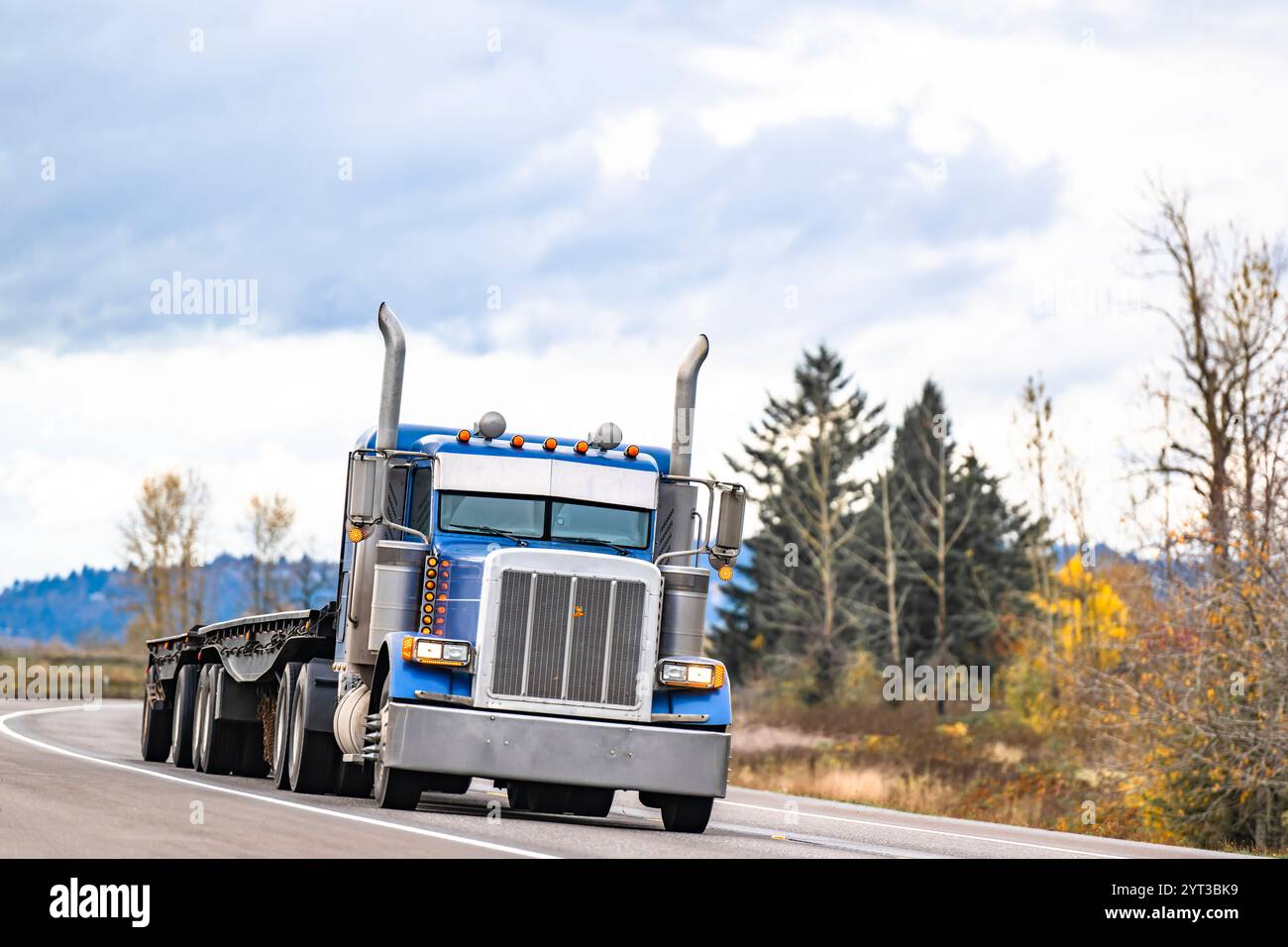 Industrial grade blue big rig classic semi truck with extended cab for truck driver rest ...