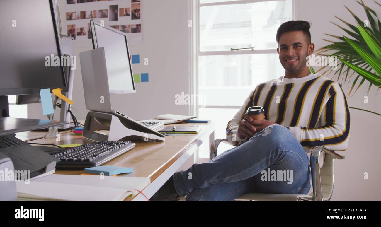 Happy biracial male creative using hi-res stock photography and images ...
