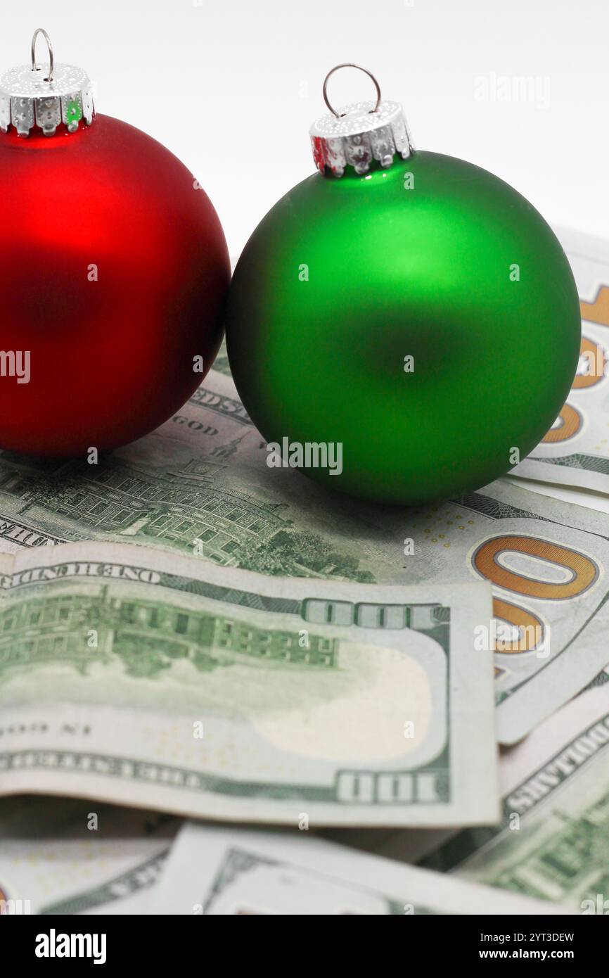 Colorful Christmas ornament on $100 dollar bills, isolated, holiday ...