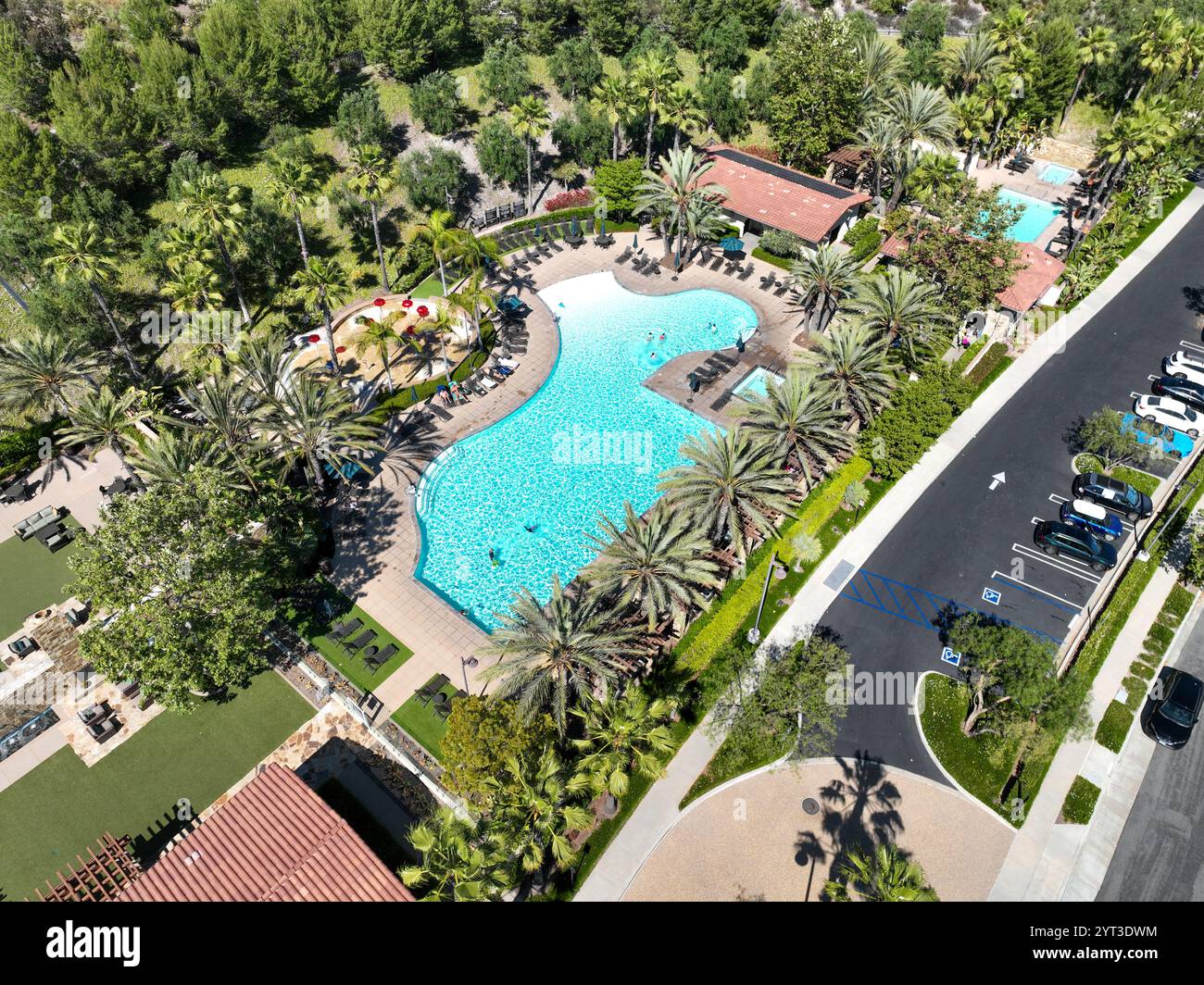 Aerial video of recreational facilities with pool in private ...