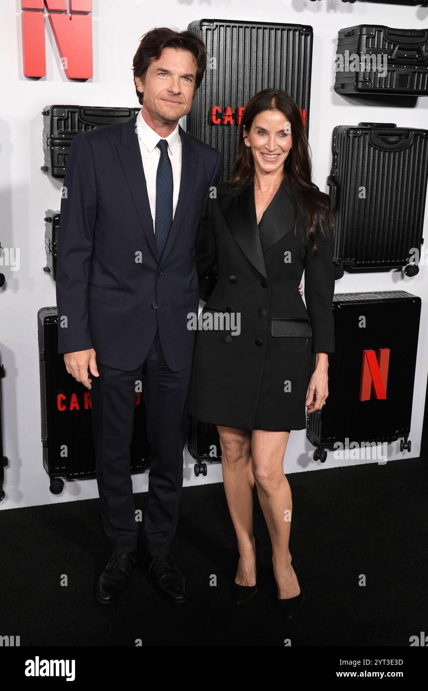 Jason Bateman, left, a cast member in "Carry-On," poses with his wife ...