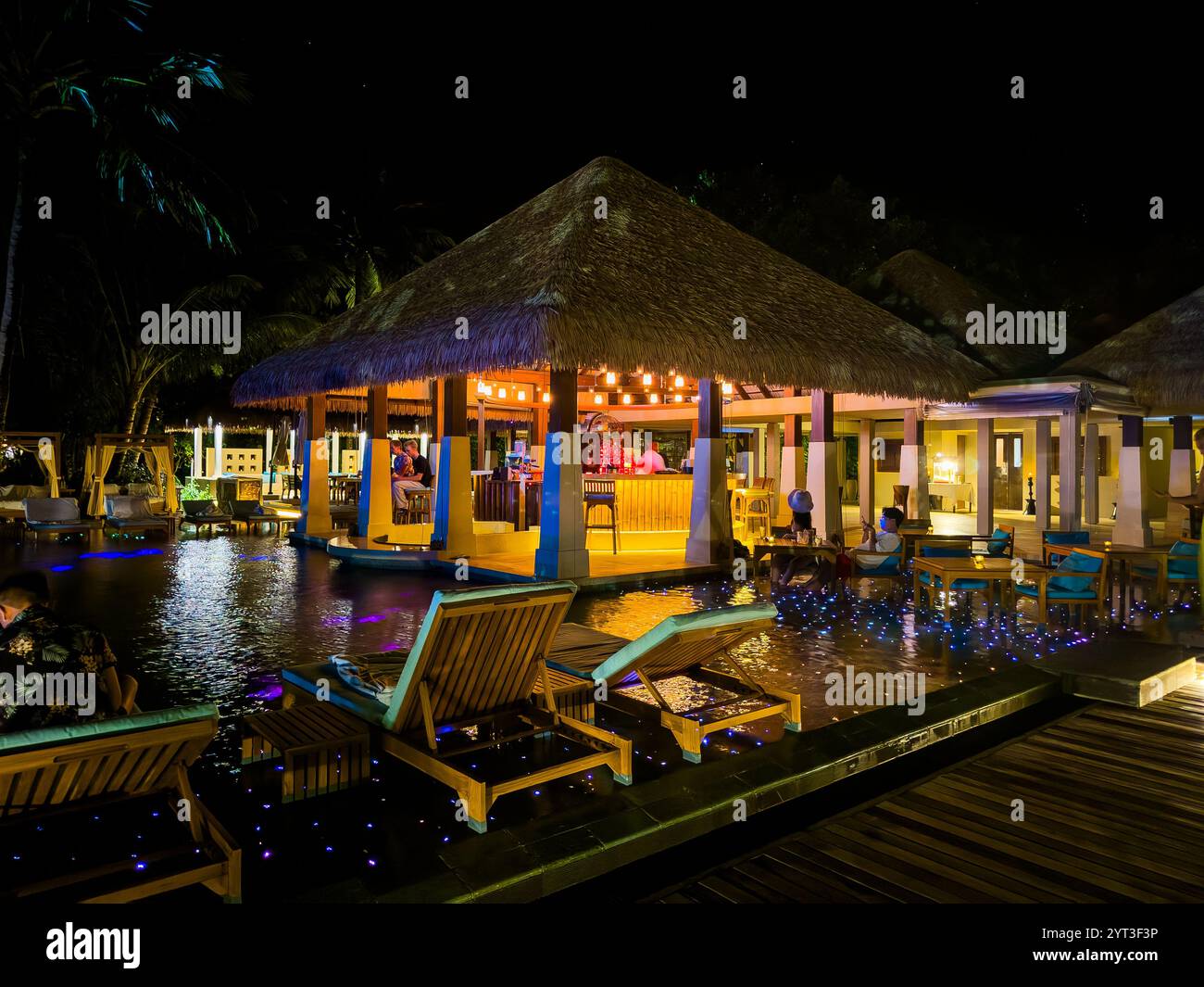Pool bar at night in the Maldives, Asia Stock Photo - Alamy