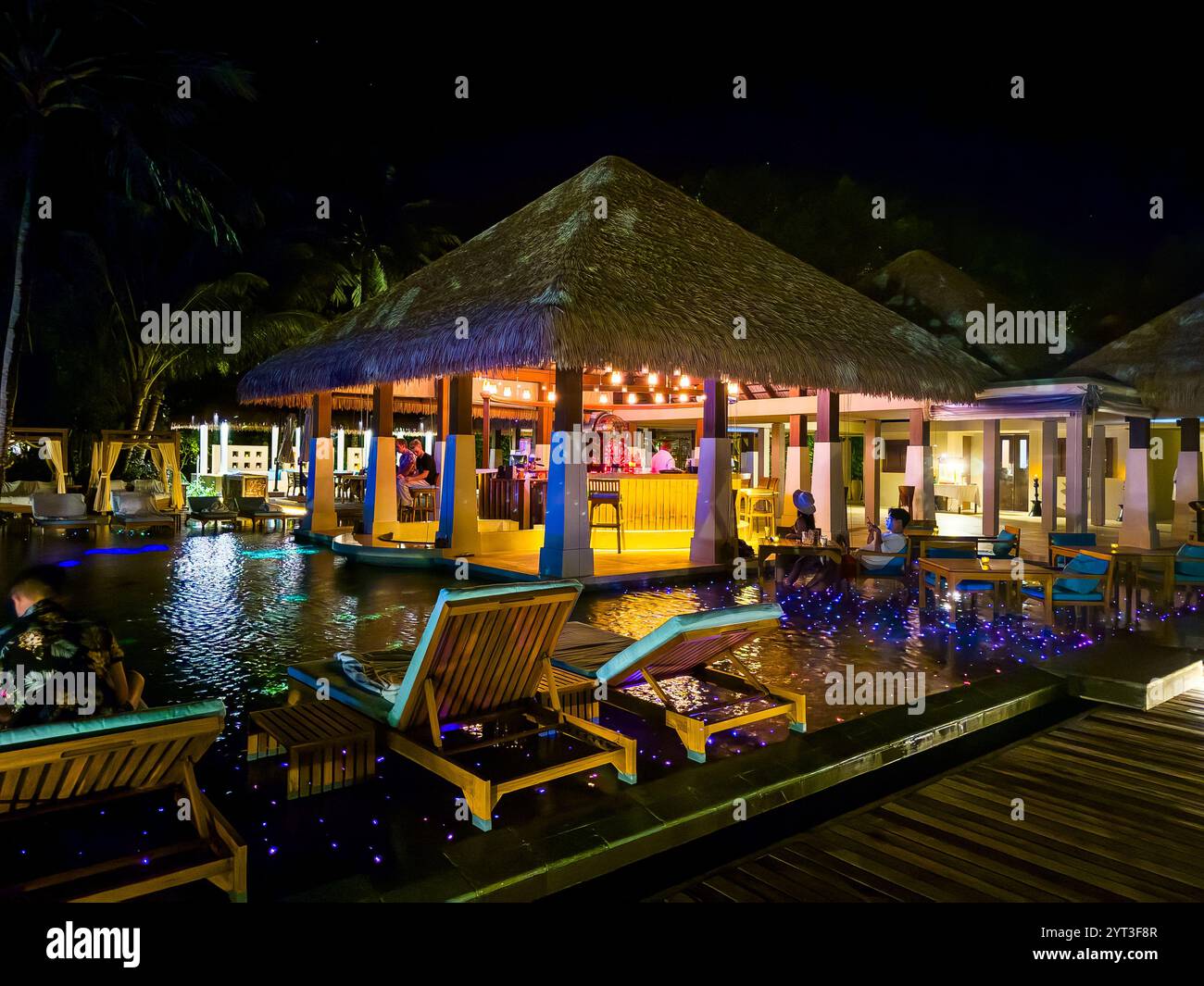 Pool bar at night in the Maldives, Asia Stock Photo - Alamy