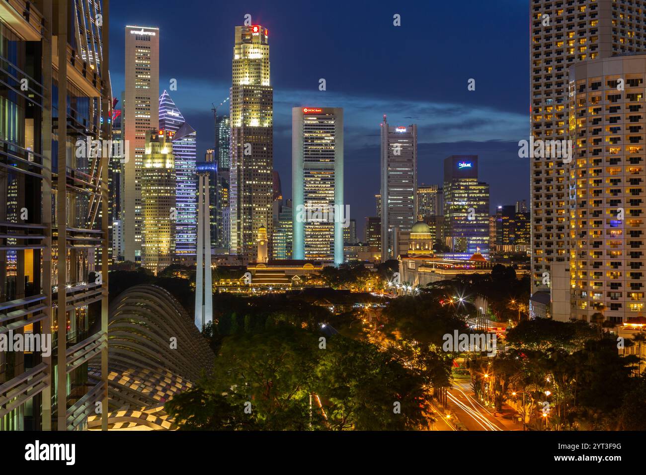Night scenery of lit up skyscraper high rise buildings in the city ...