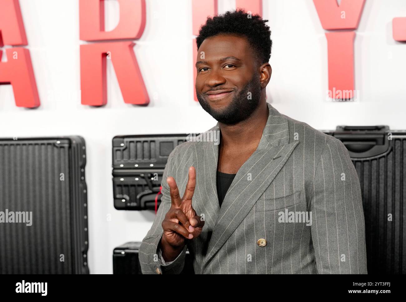 Sinqua Walls, a cast member in "Carry-On," poses at the premiere of the ...