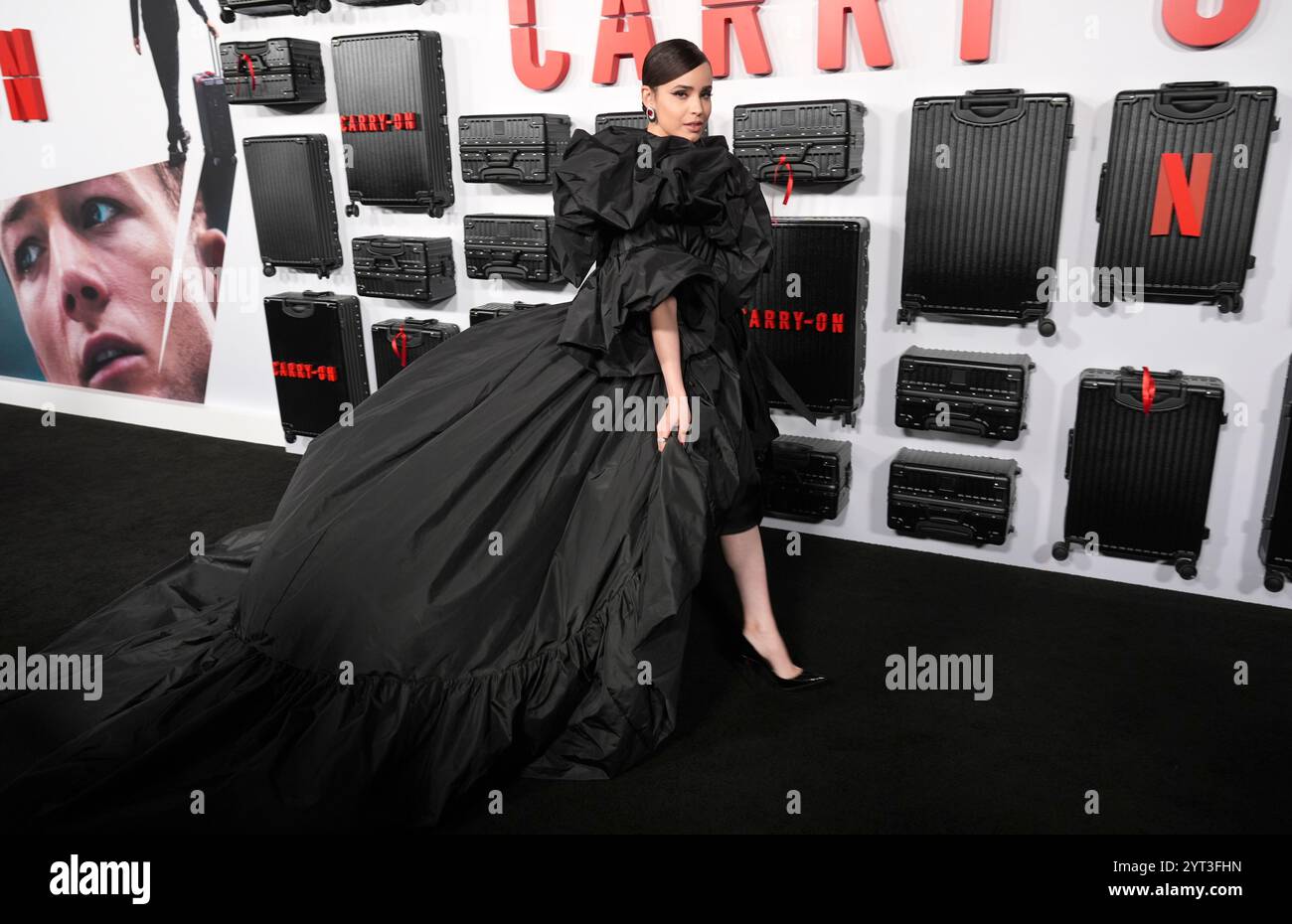 Sofia Carson, a cast member in "Carry-On," walks the carpet at the ...