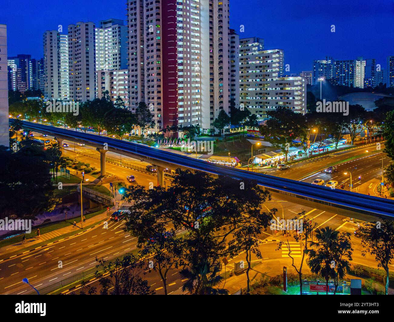 Urban scenery showcasing tall buildings, well-lit roadways, and ...