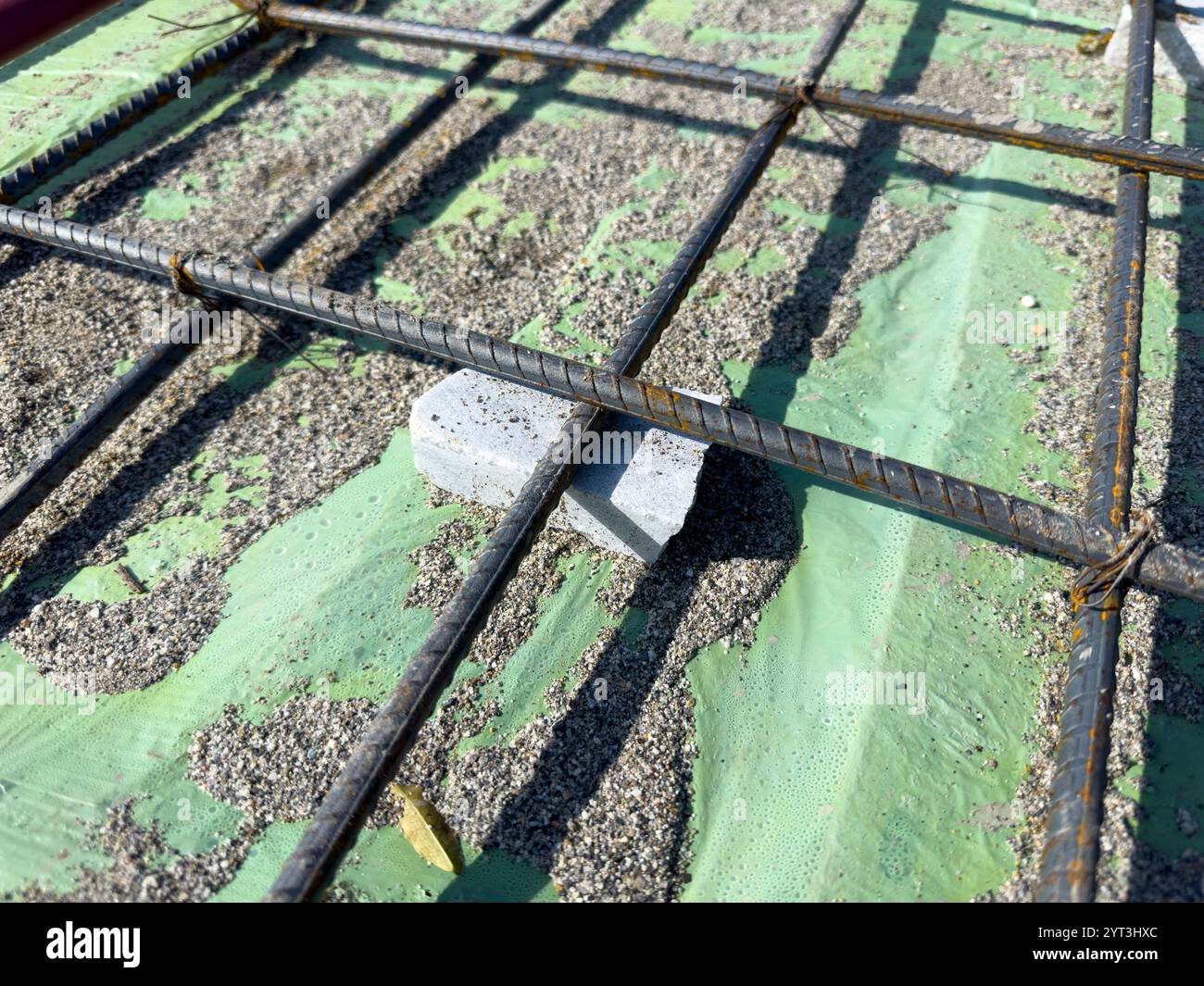 Cover block or spacer is use to lift the rebar mesh off the ground so that concrete may flow ...
