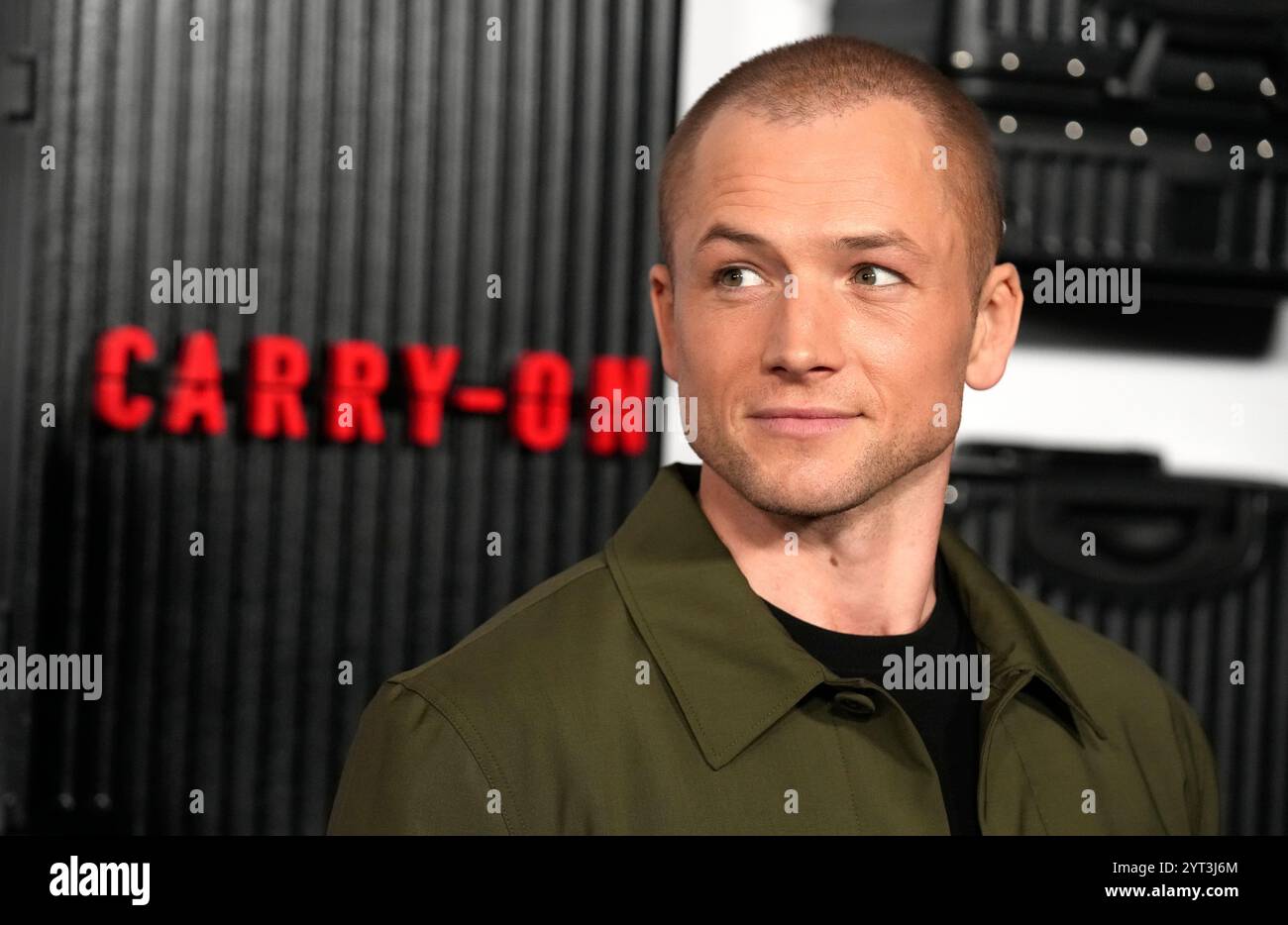 Taron Egerton poses at the premiere of the film "Carry-On" on Thursday ...