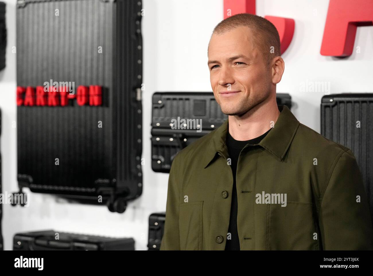 Taron Egerton poses at the premiere of the film "Carry-On" on Thursday ...