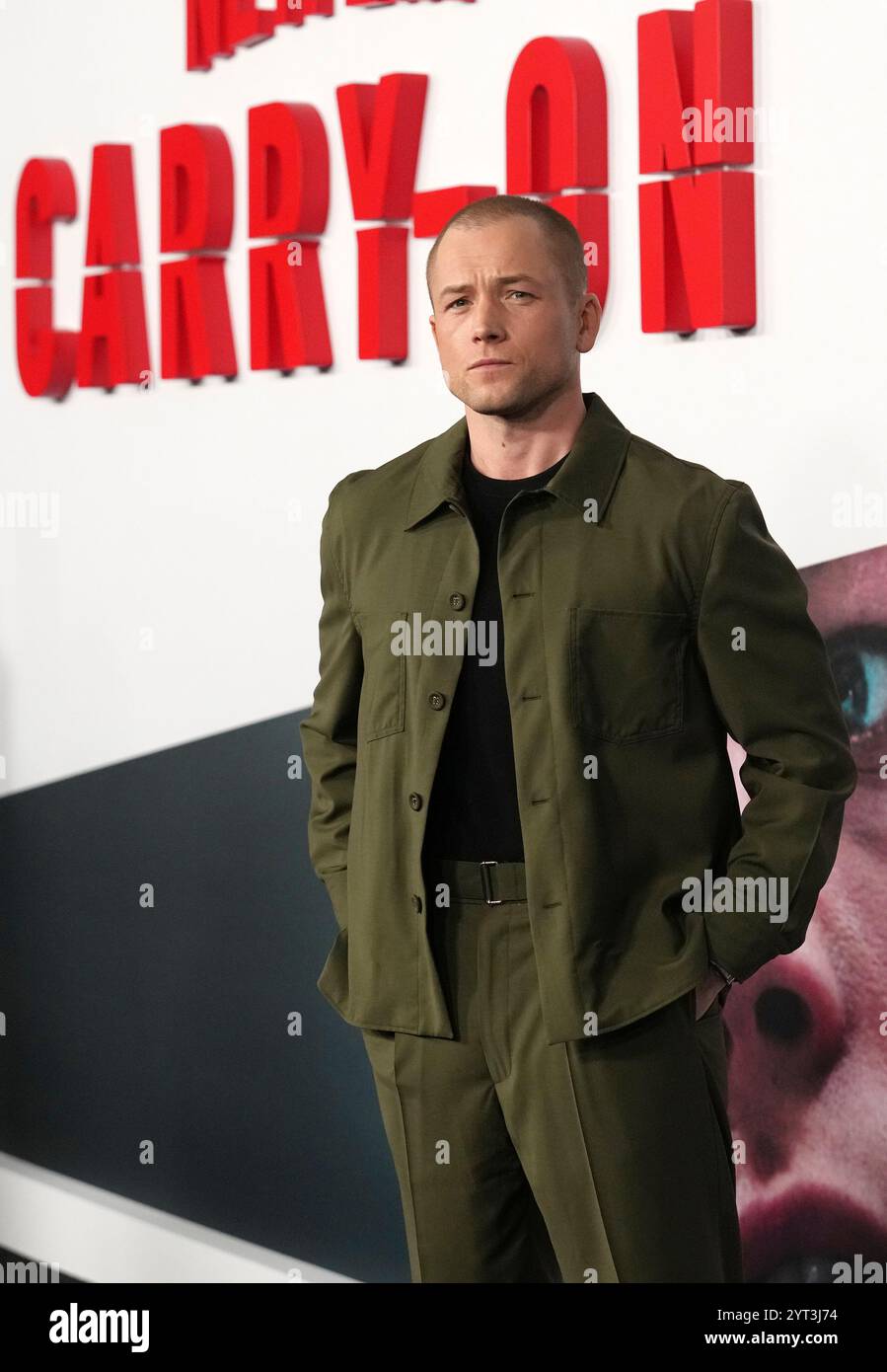 Taron Egerton poses at the premiere of the film "Carry-On" on Thursday ...