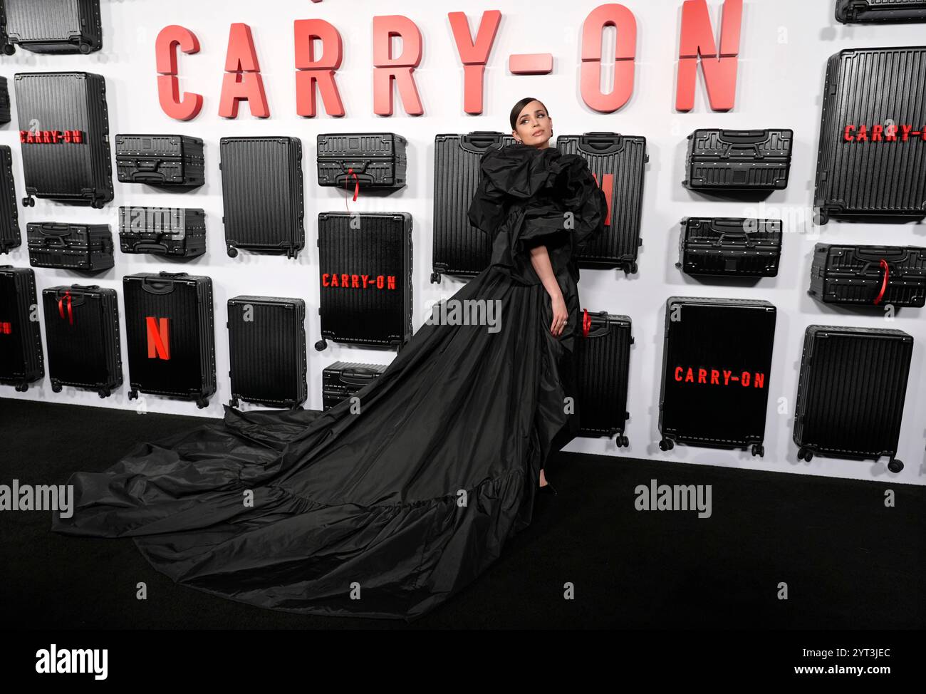 Sofia Carson, a cast member in "Carry-On," turns back for photographers ...