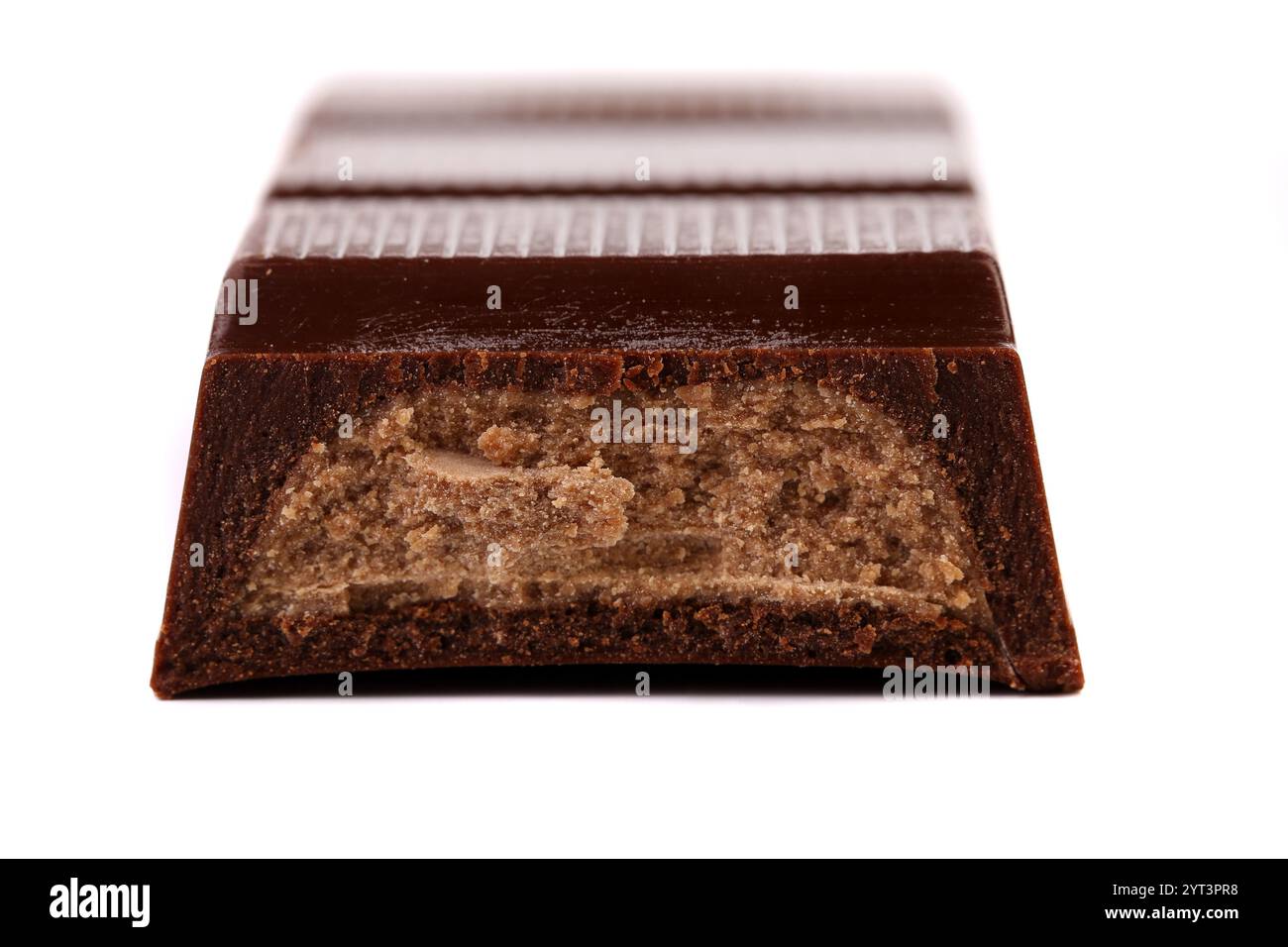 Bar of chocolate with a filling. Macro. White background Stock Photo ...