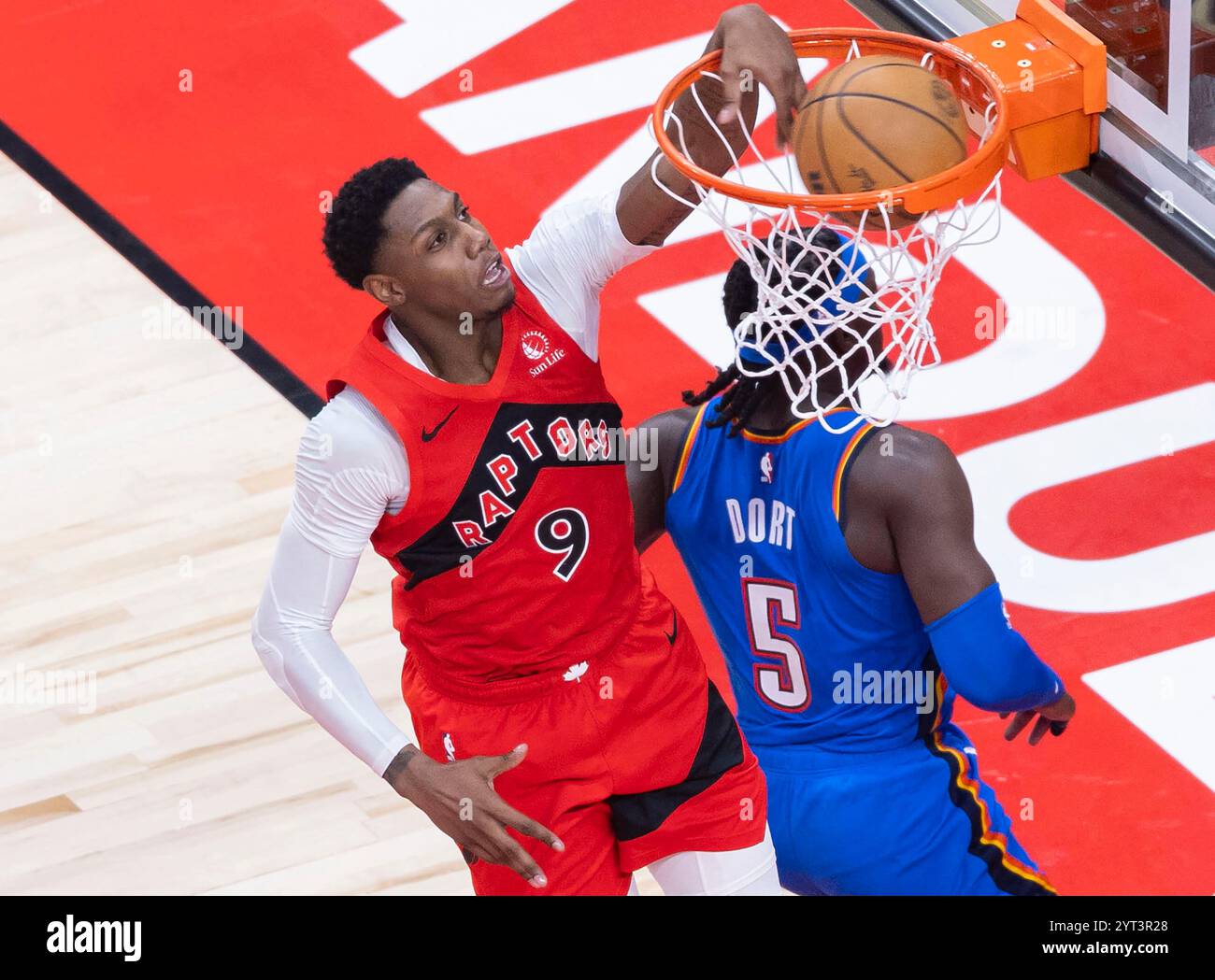 Toronto, Canada. 5th Dec, 2024. RJ Barrett (L) of Toronto Raptors dunks during the 2024-2025 NBA ...