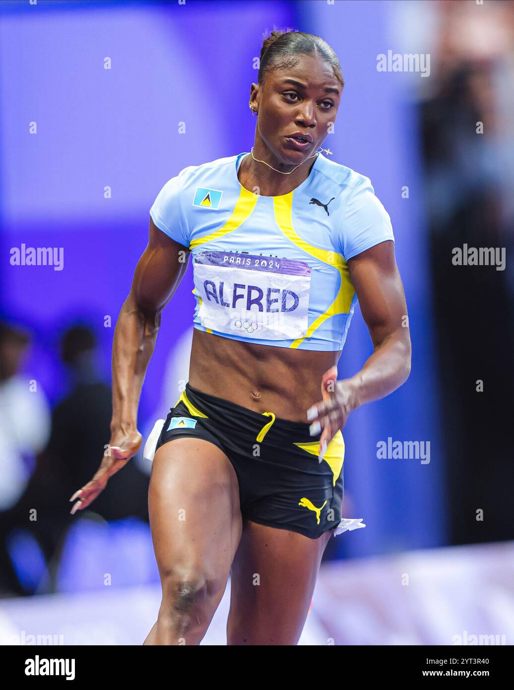 Julien Alfred participating in the 200 meters relay at the Paris 2024 ...