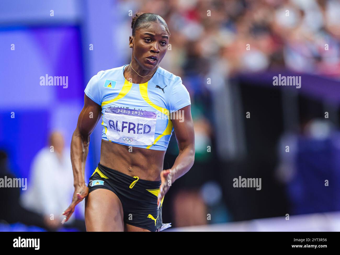 Julien Alfred participating in the 200 meters relay at the Paris 2024 ...