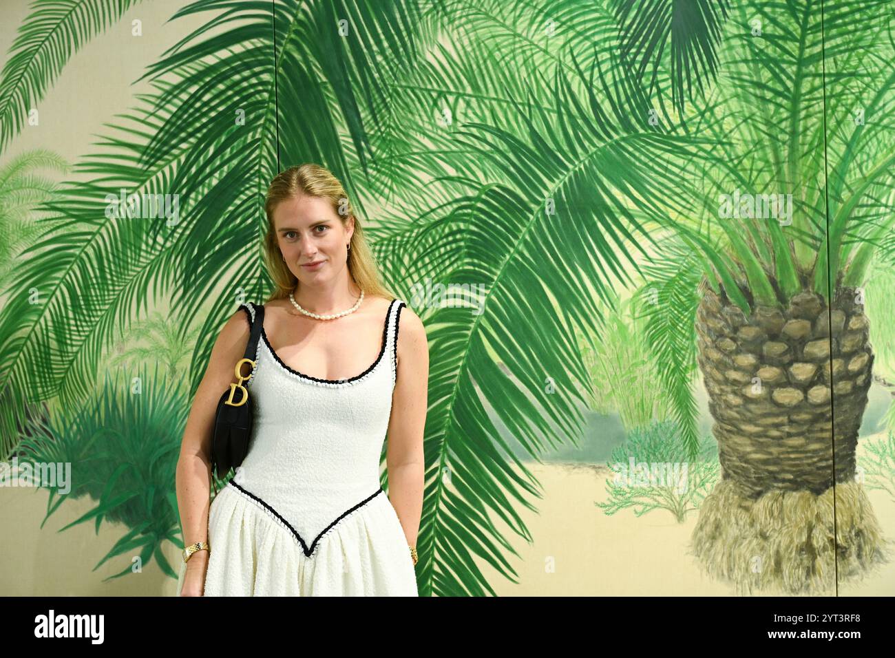 Alizah Corder of Miami Beach poses for a photo at day 2 of Art Basel on ...