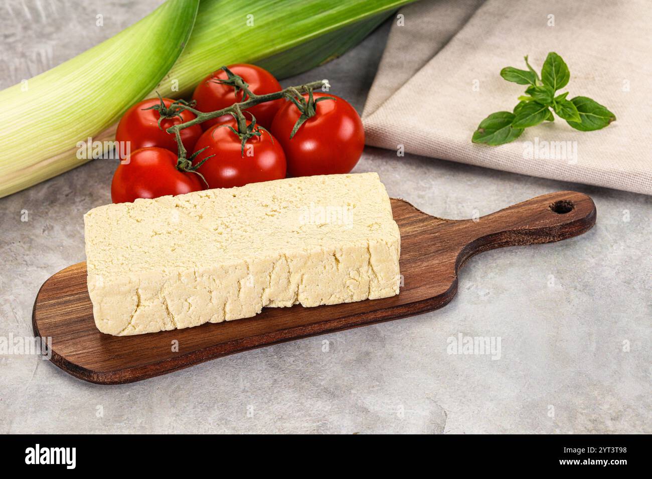 Soya vegan tofu cheese brick over board Stock Photo - Alamy