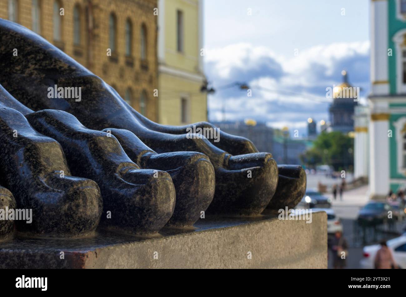 Five granite toes on a statue of Titan or Atlas in close-up and on a ...