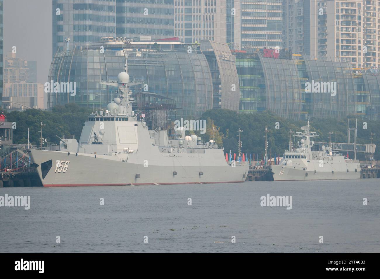 SHANGHAI, CHINA - DECEMBER 6, 2024 - Chinese navy type 052DL frigate DDG-156 Zibo and Type 056A ...