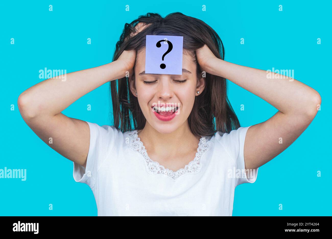 Desperate young woman is looking utterly confused with question marks ...