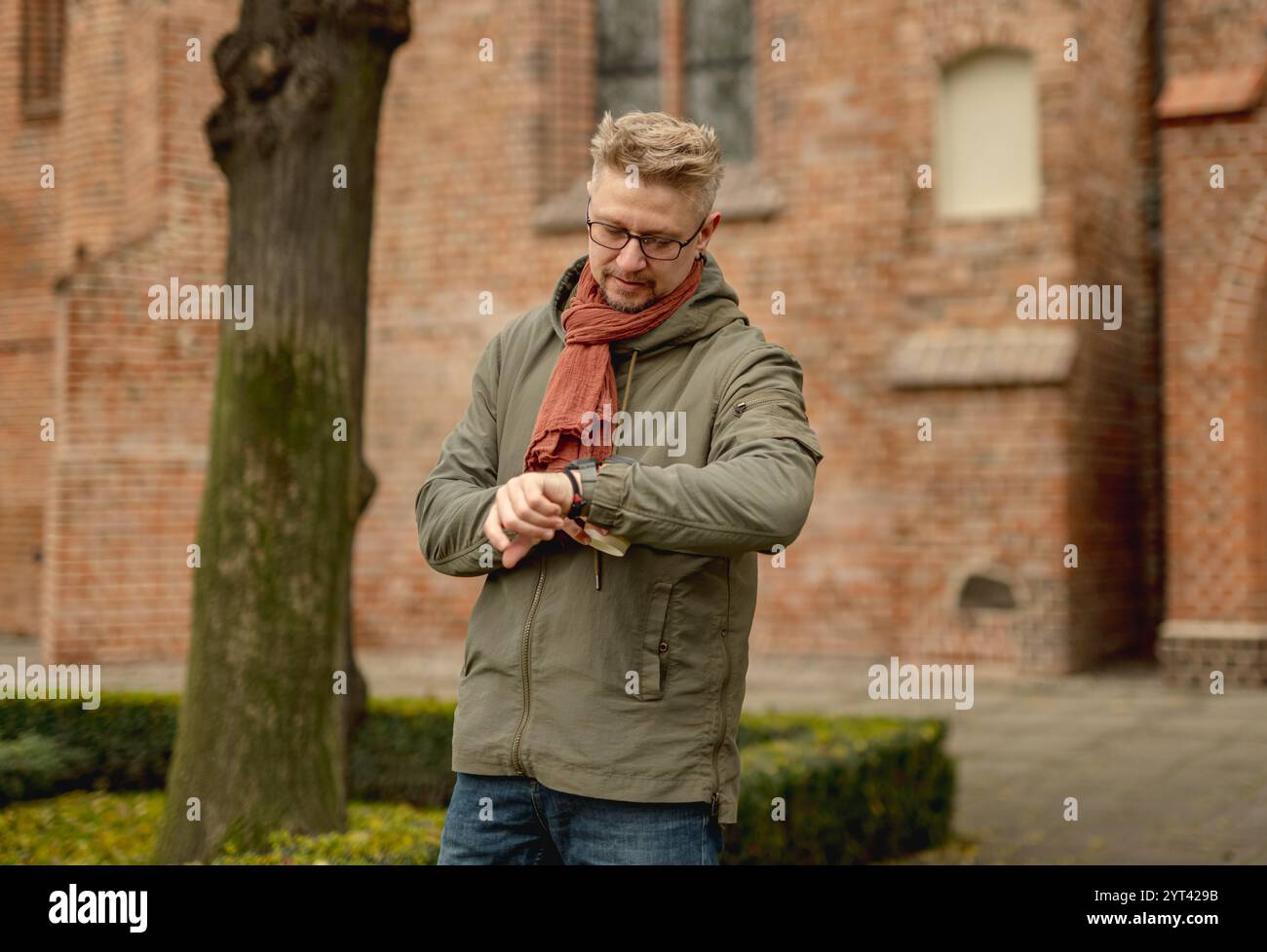 Attractive Man Sightseeing And Checking The Time Of Excursion Stock ...
