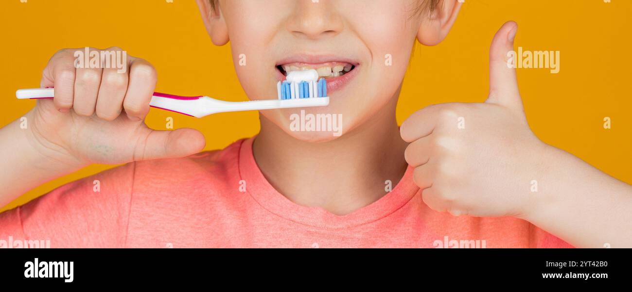 Dental hygiene. Happy little kid brushing her teeth. Kid boy brushing ...