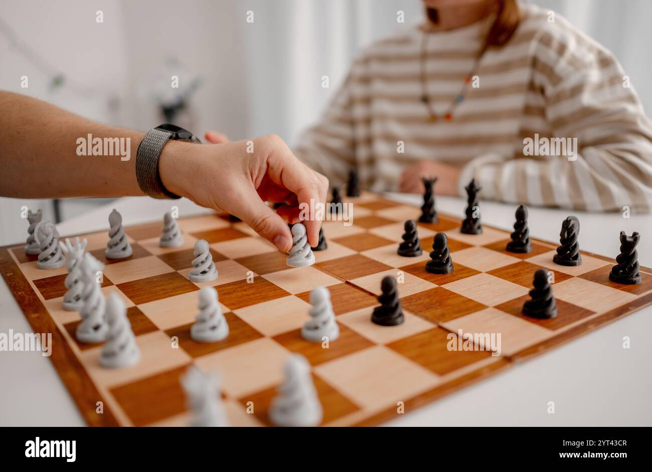 Little Girl Has A Game Of Chess At Home, father hand holds a chess ...