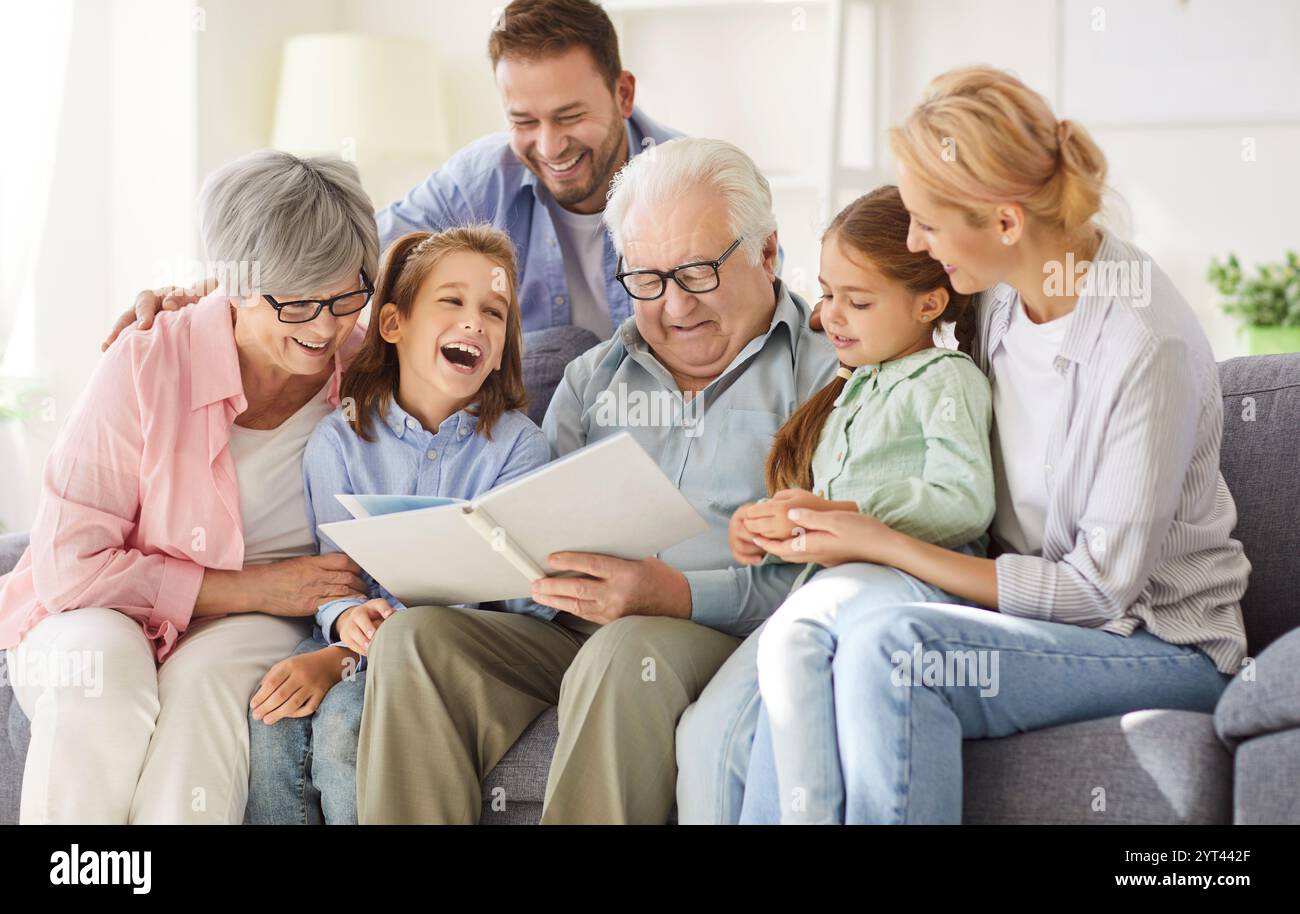 Happy big family, gathering at home on sofa, laughing three generations ...