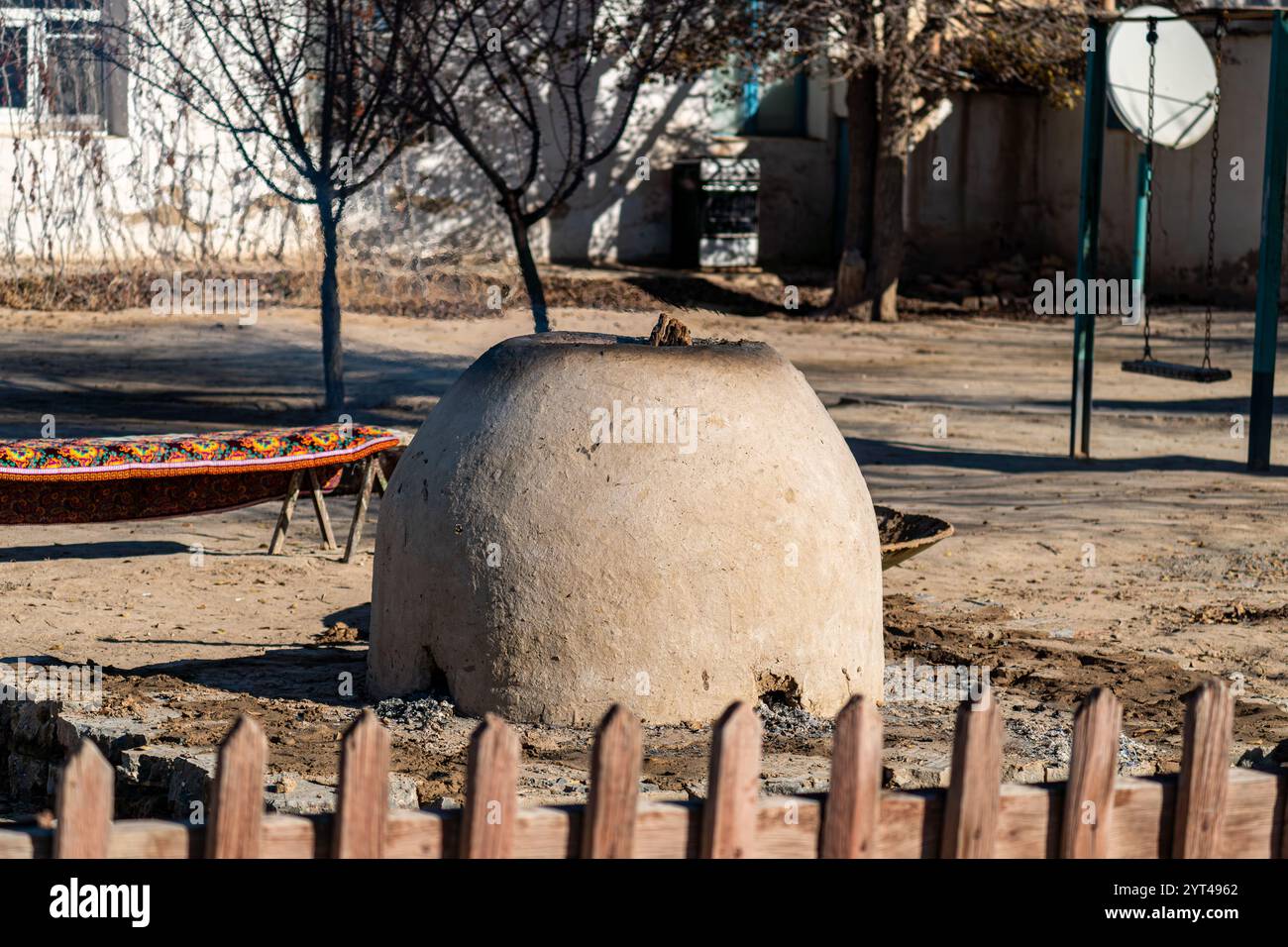 A traditional Asian clay tandoor for baking bread and tortillas in the ...