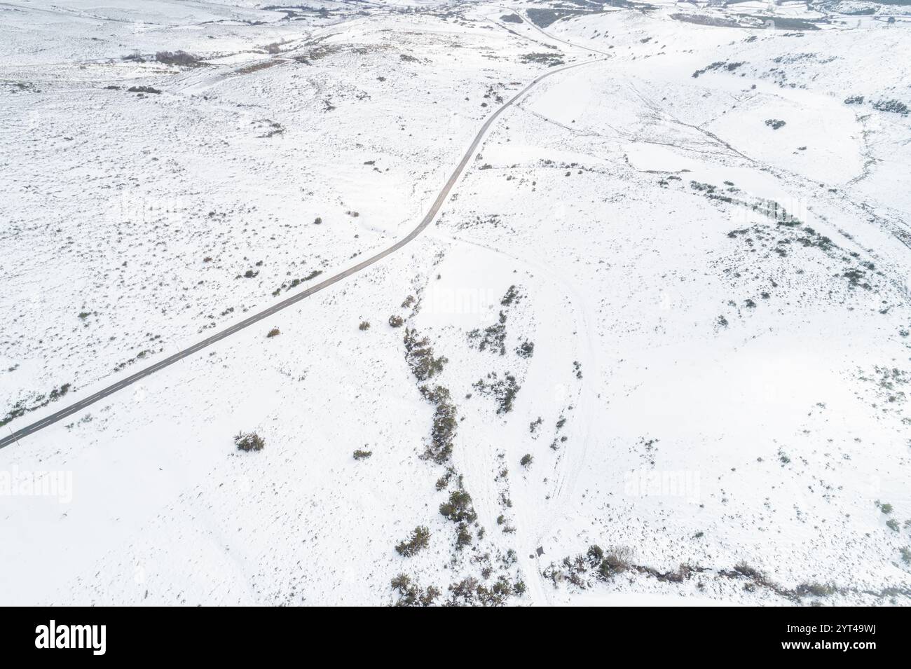 snow-covered mountain road from above, a winter wonderland. aerial ...