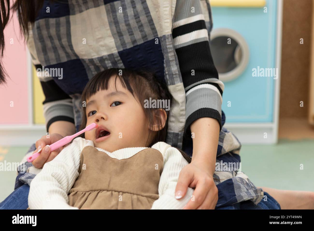 Child getting his teeth brushed Stock Photo - Alamy