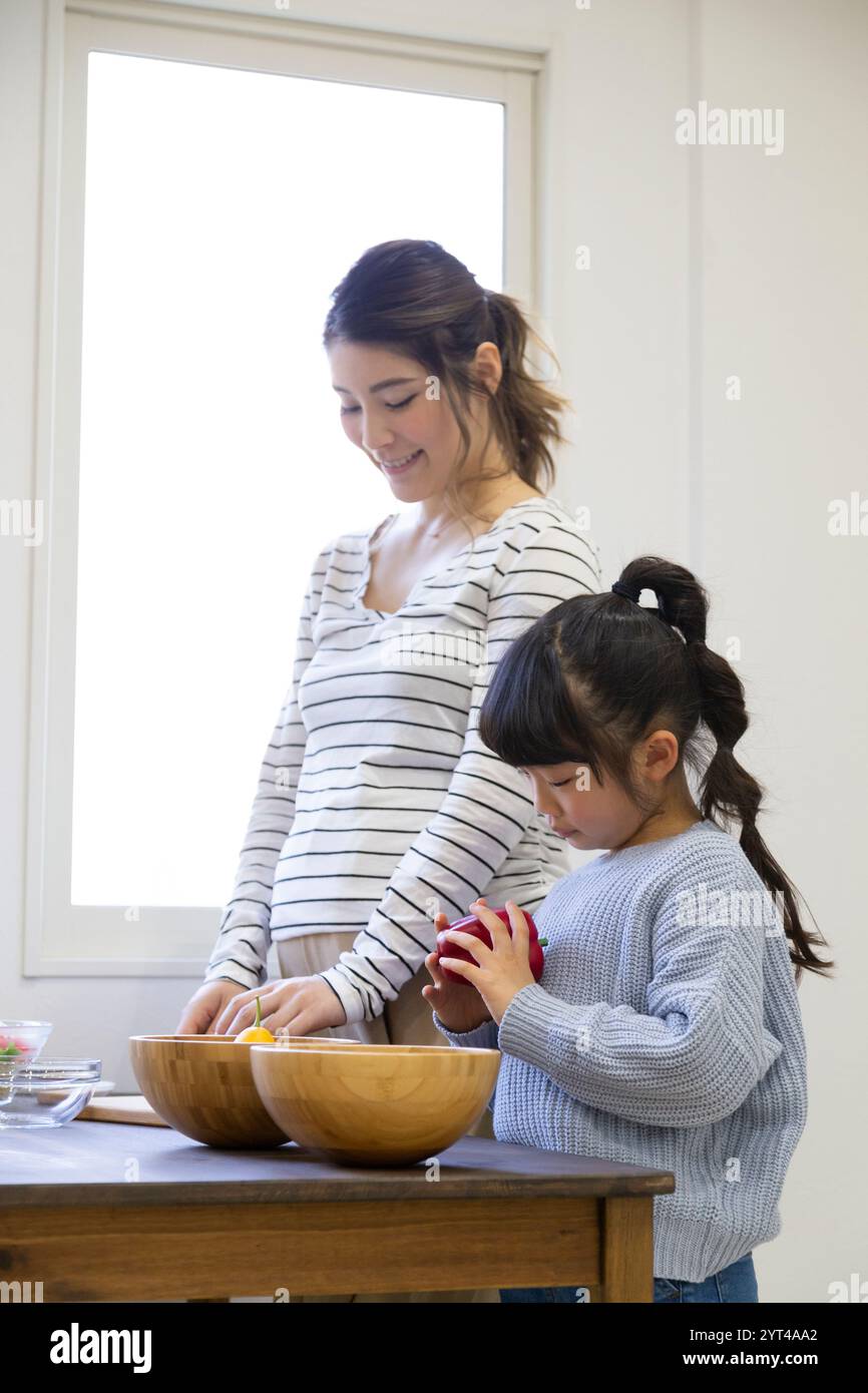 Parent and child cooking Stock Photo - Alamy