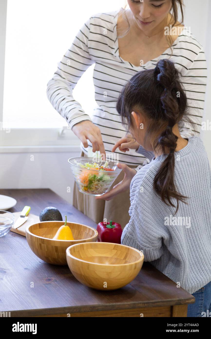 Parent and child cooking Stock Photo - Alamy