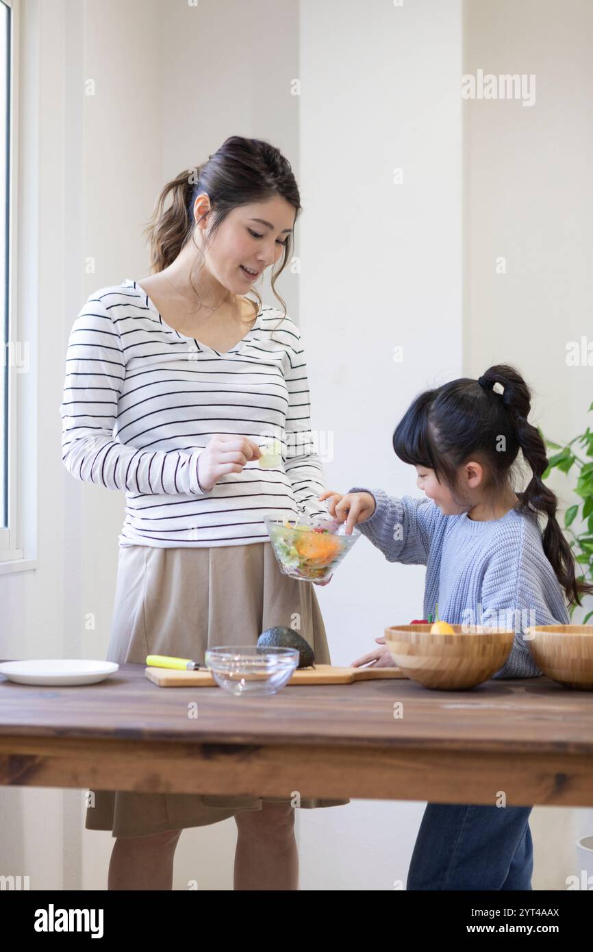 Parent and child cooking Stock Photo - Alamy