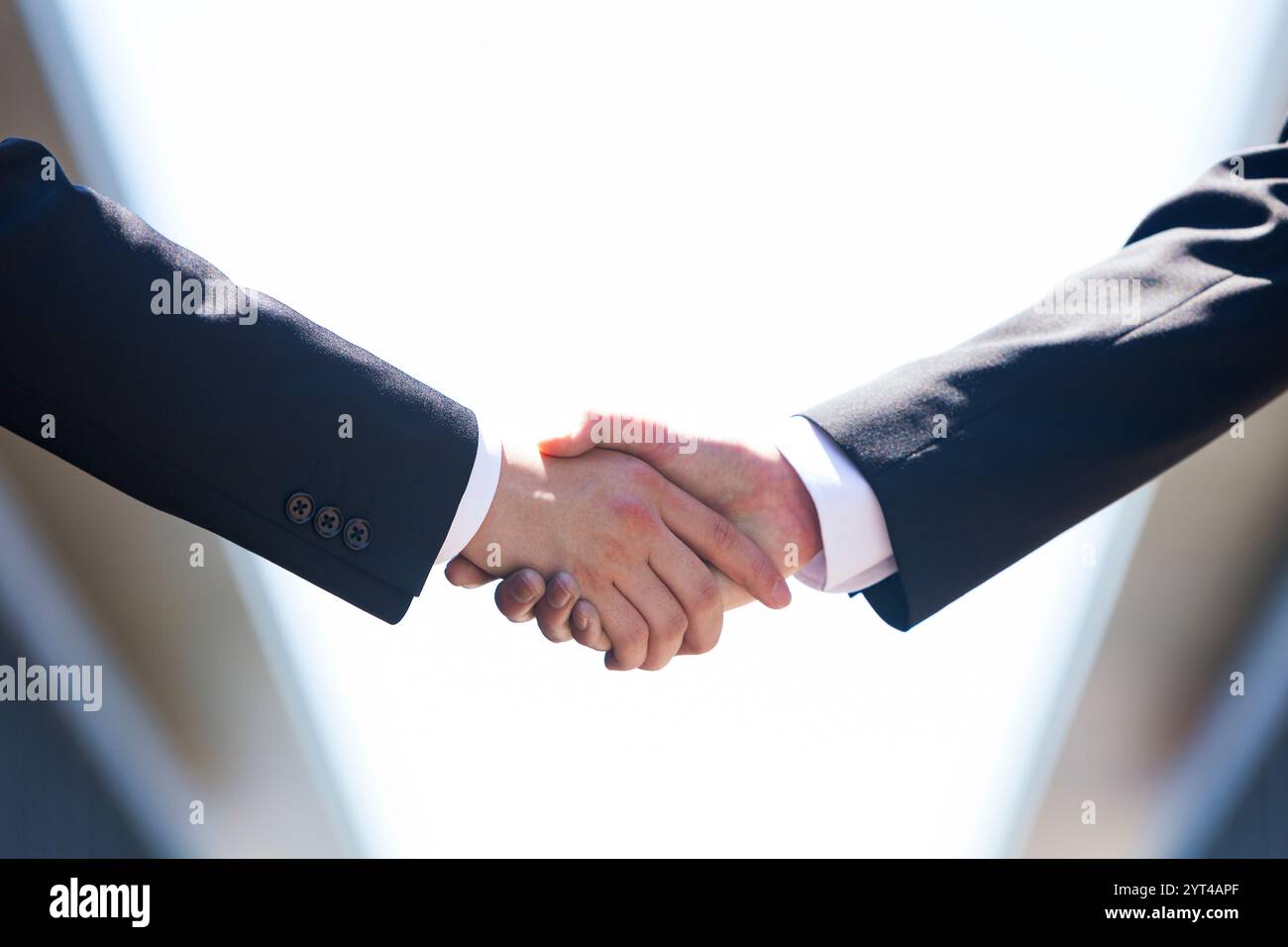 Businessman shaking hands Stock Photo - Alamy