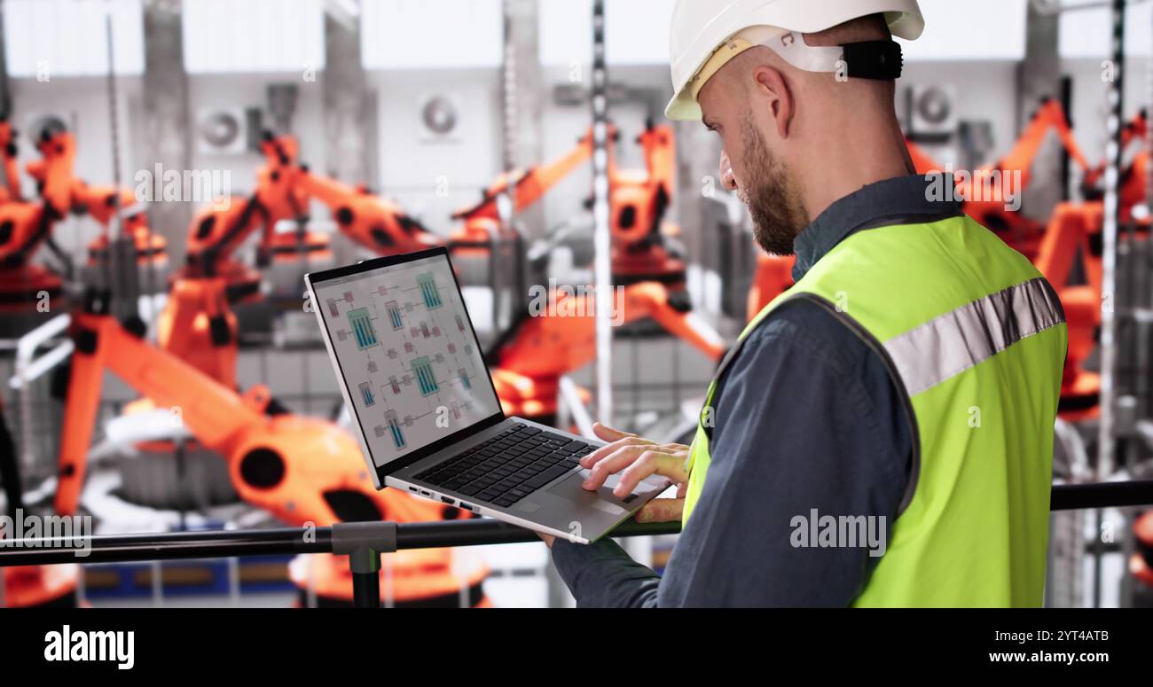 Men In Automotive Car Factory Using Scada System Stock Photo - Alamy